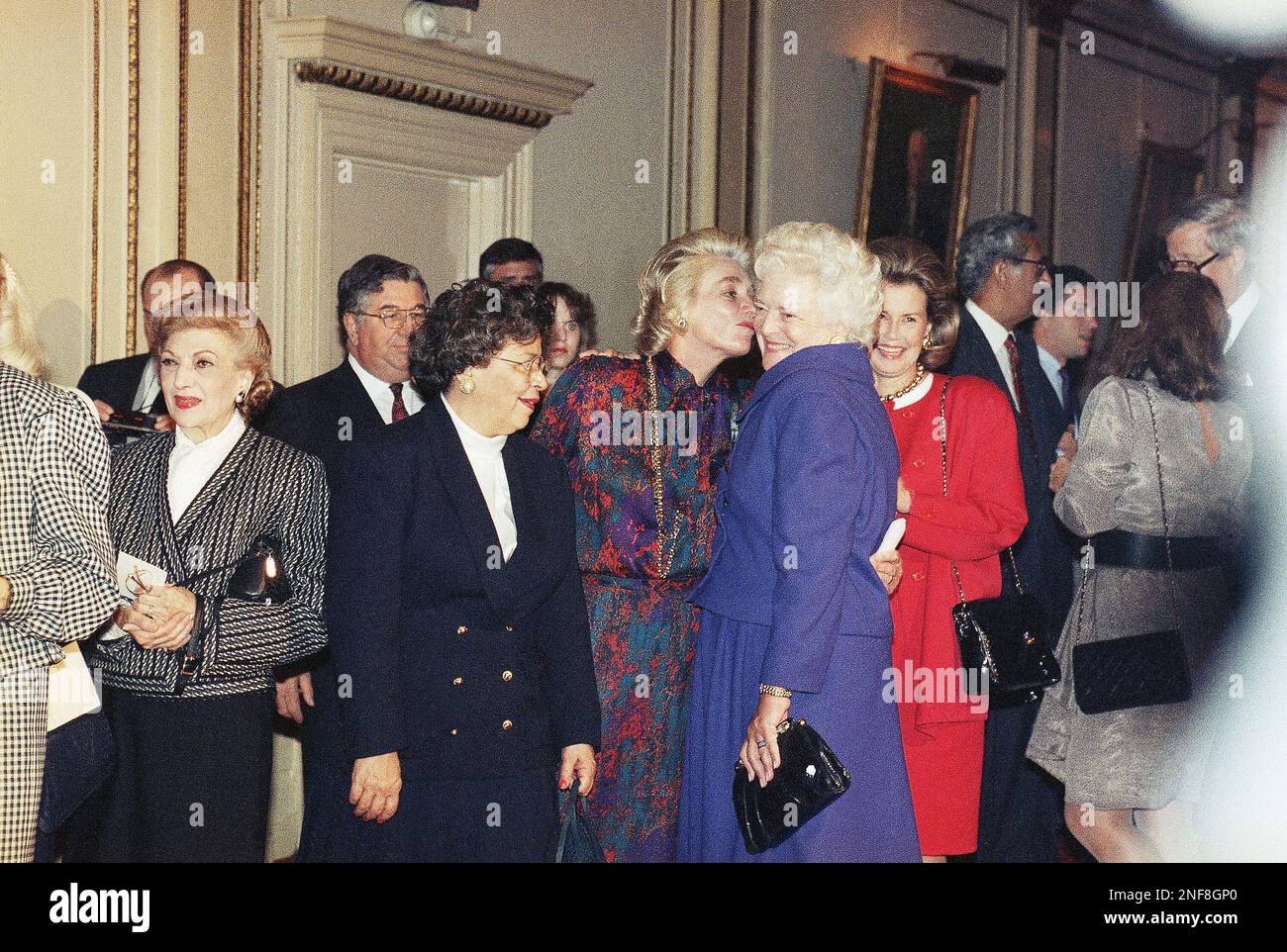 First Lady Barbara Bush, center, is kissed by Happy Rockefeller as ...