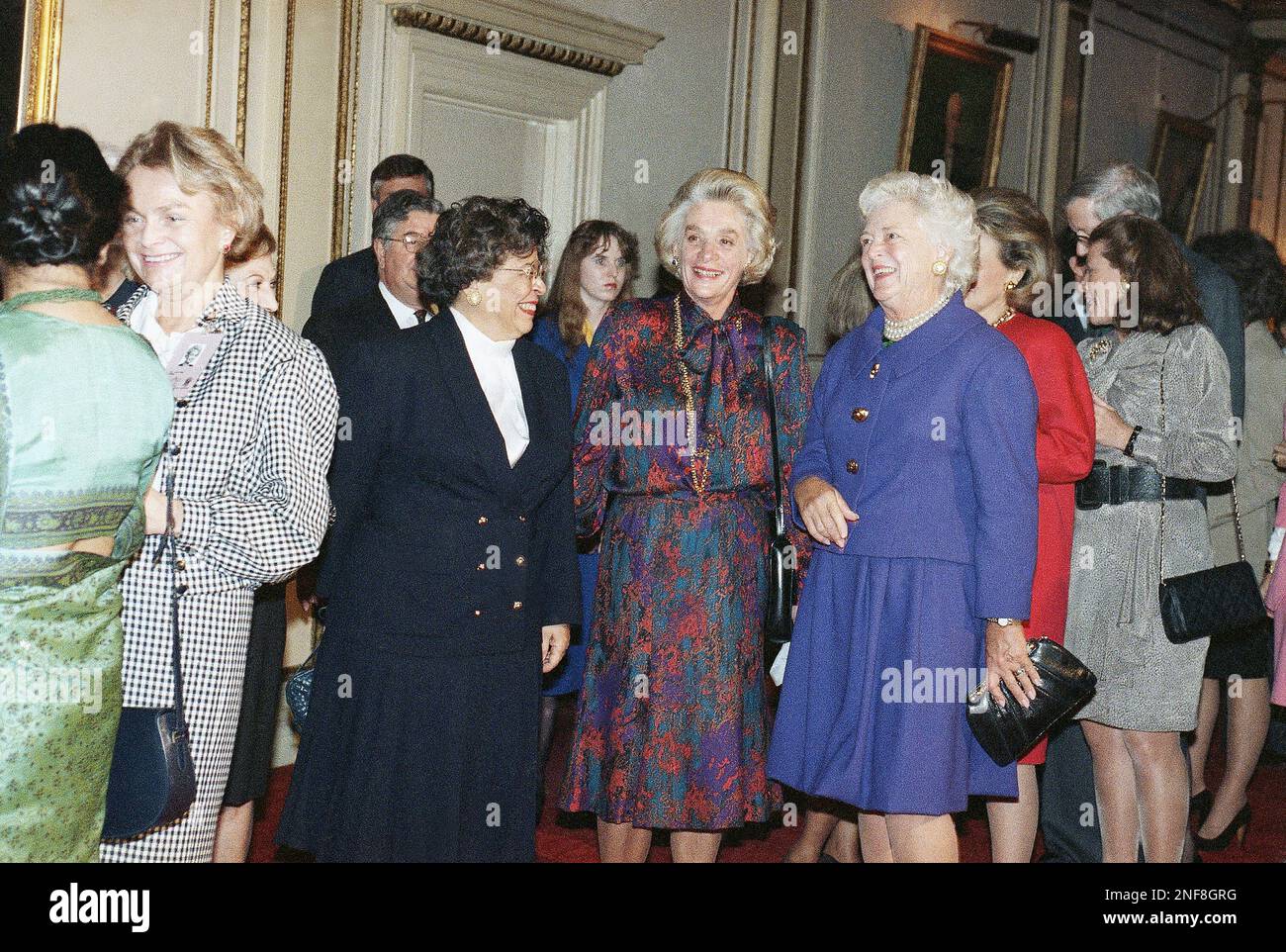 First Lady Barbara Bush, center, is kissed by Happy Rockefeller as ...