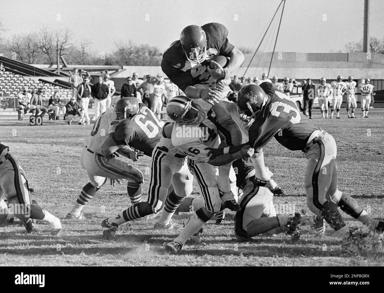 Arkansas State's Calvin Harrell (49) goes high in the air to score from ...