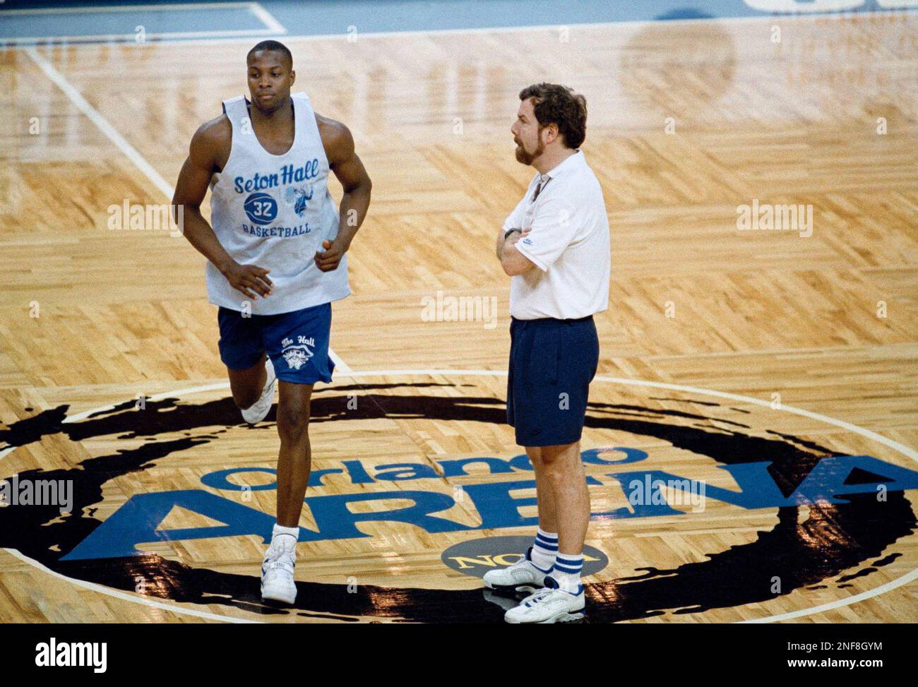 Seton Hall coach P.J. Carlesimo stands in the middle of the Orlando ...