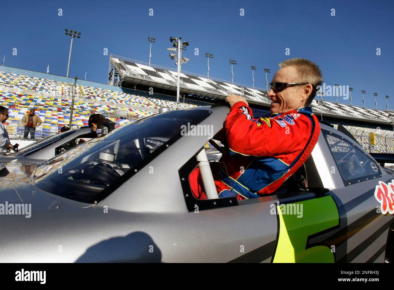 NASCAR driver Mark Martin gets in his car to take a lap around the ...