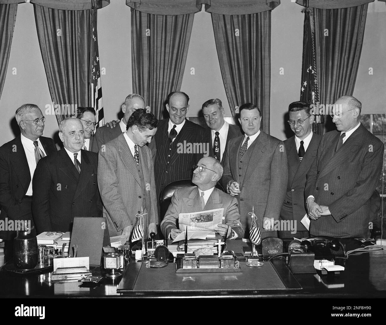President Harry Truman poses with a group of CIO leaders who called on ...