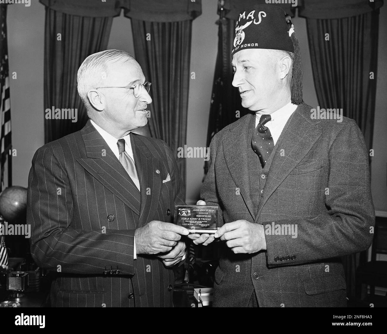 President Harry Truman, left, receives an honorary card to the Shrine ...