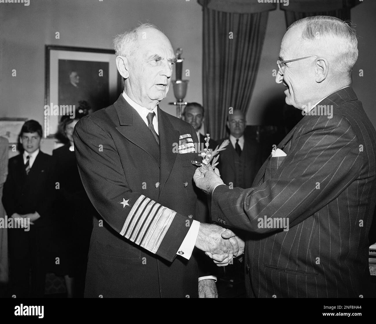 President Harry Truman awards a Distinguished Service medal to fleet ...