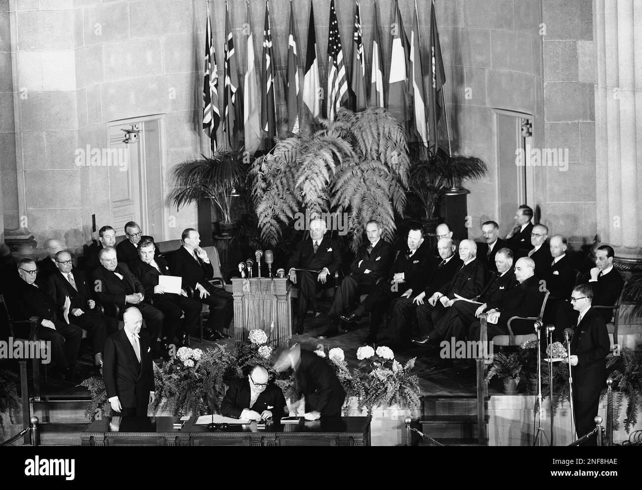 Prime and Foreign Minister Paul-Henri Spaak of Belgium tests a pen ...