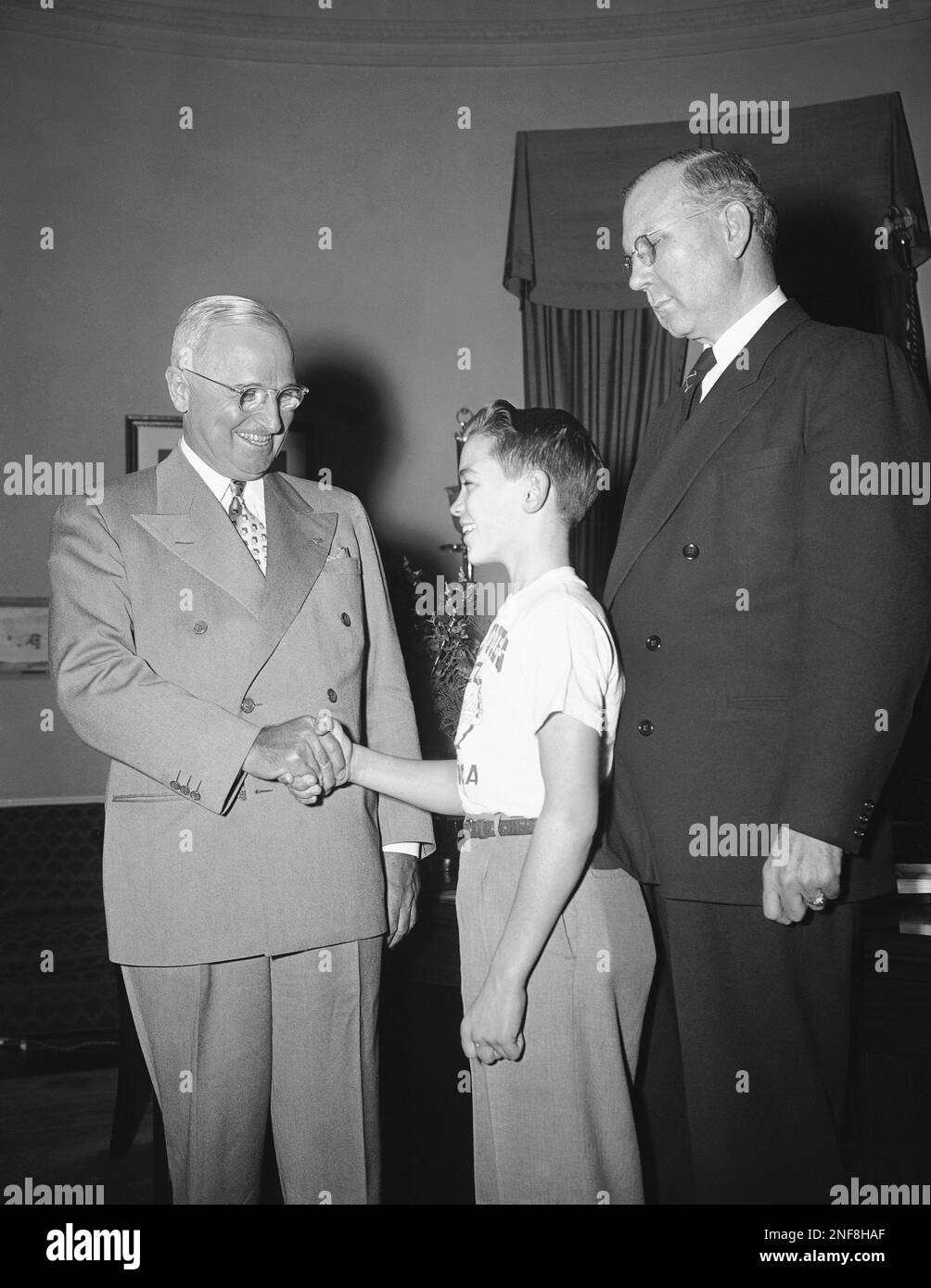 President Harry Truman, left, shakes hands with the "National Boy of ...