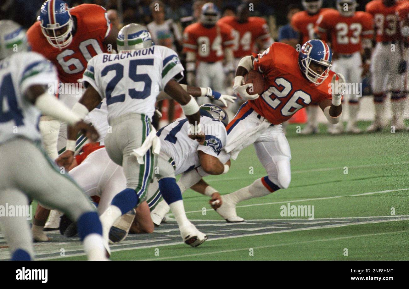 Denver Broncos’ Bobby Humphrey (26) is tackled by Seattle Seahawk ...