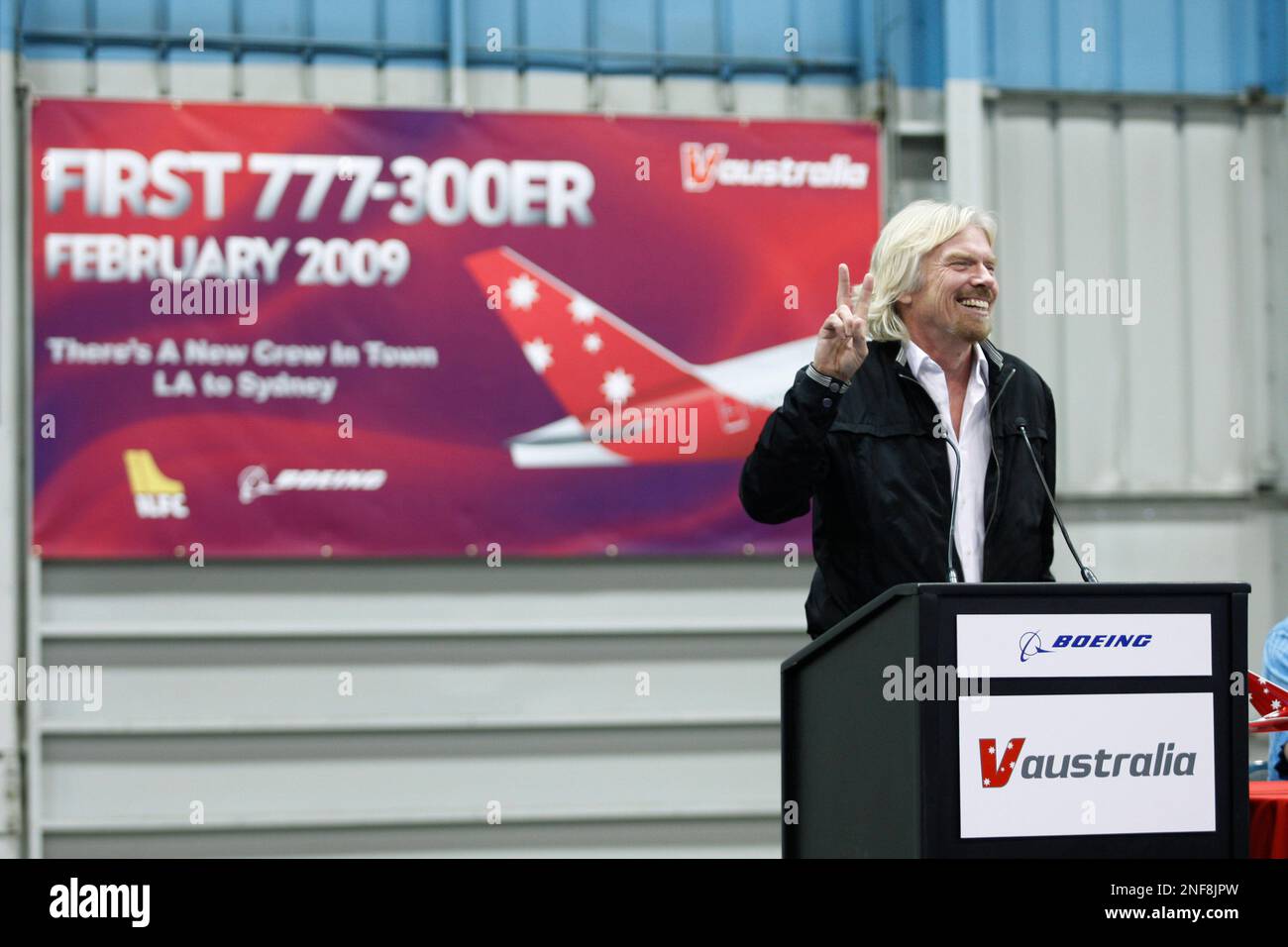 Sir Richard Branson, chairman of Virgin Group, makes the "V" symbol of ...