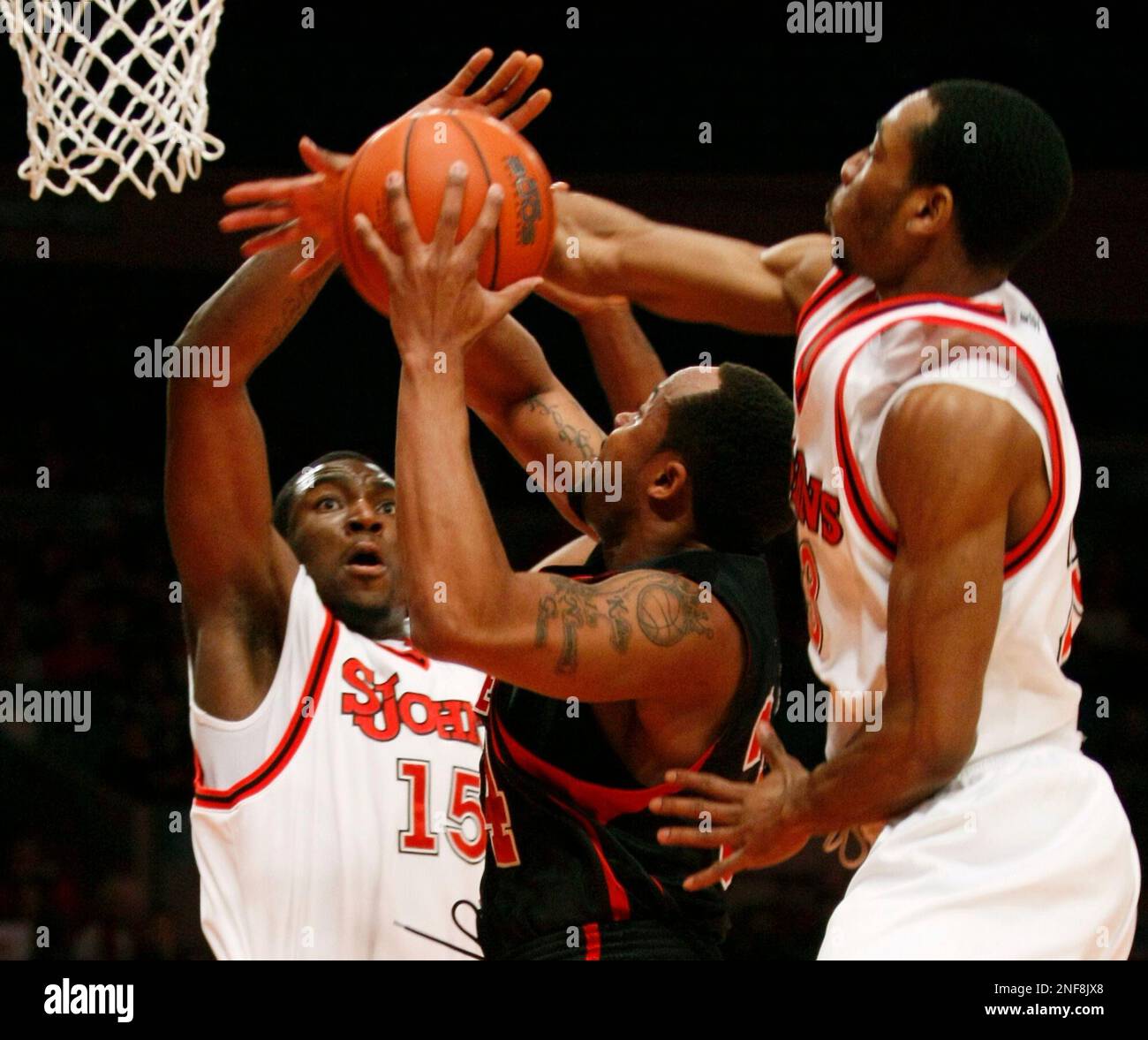 St.John's guard Paris Horne, right, knocks the ball loose from the ...