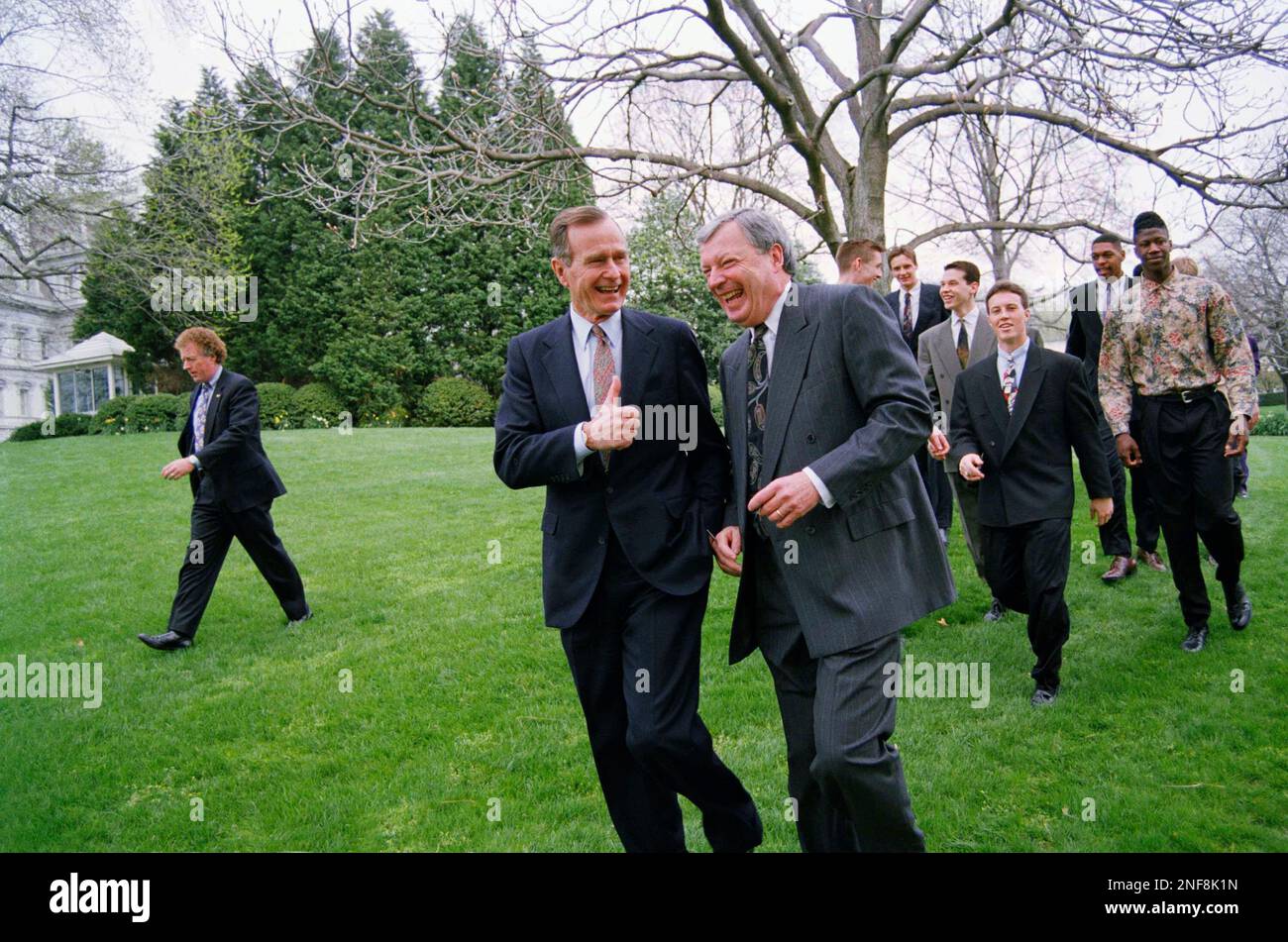 President George Bush, left, and former Notre Dame basketball coach ...