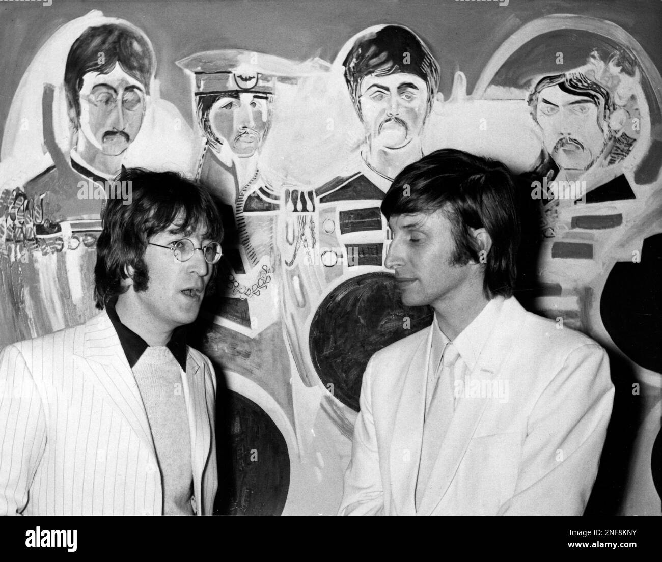 John Lennon and artist Jonathan Hague (right) talk infront of 'The ...