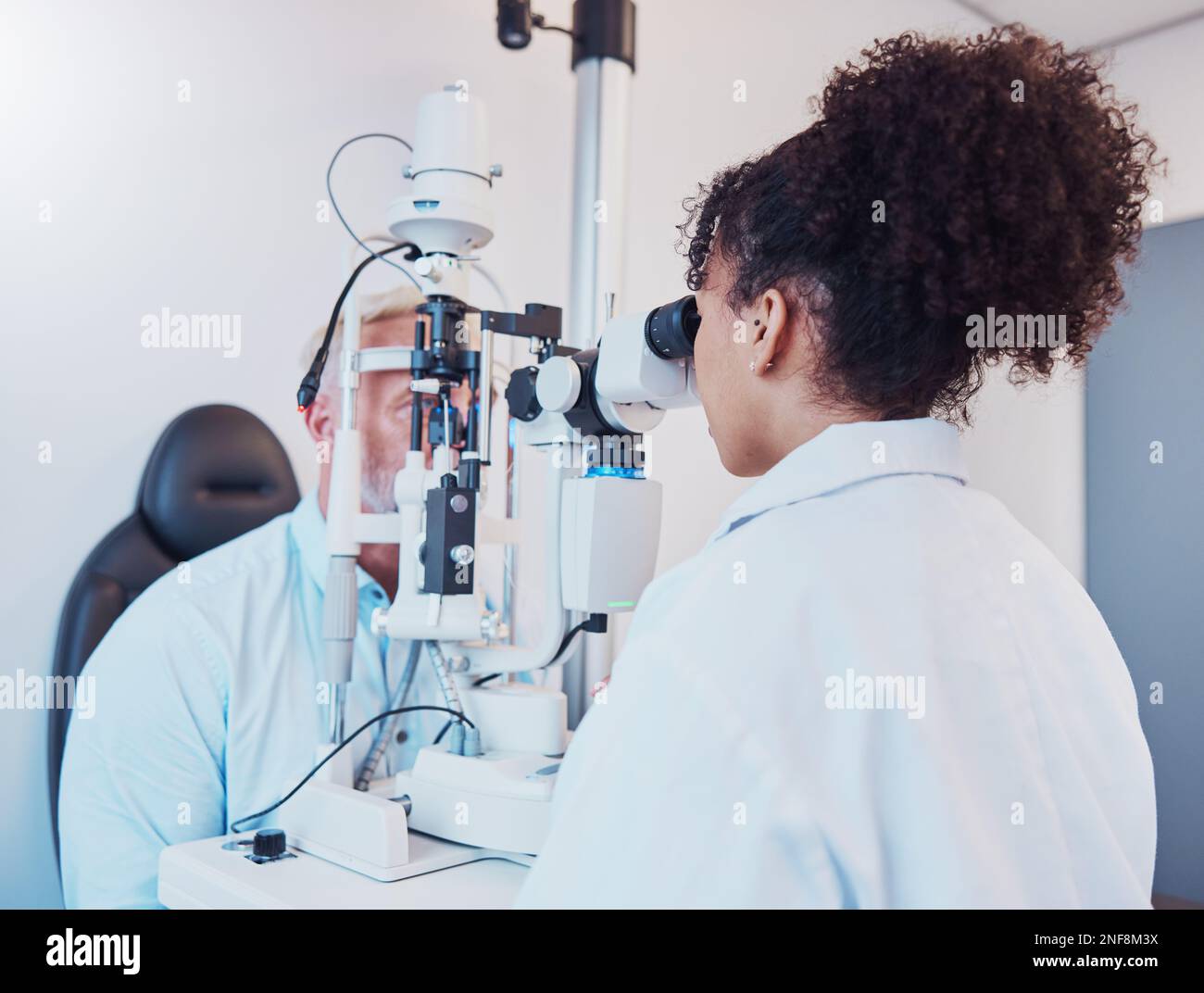 Optometry, eye exam and ophthalmologist testing patient vision or eyes ...