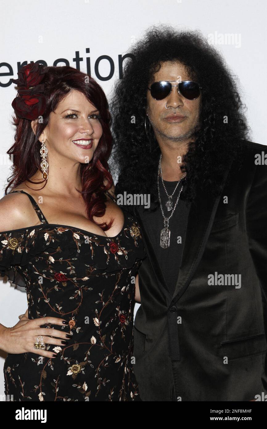 Slash and his wife Perla Ferrar arrive at the Clive Davis pre-Grammy ...