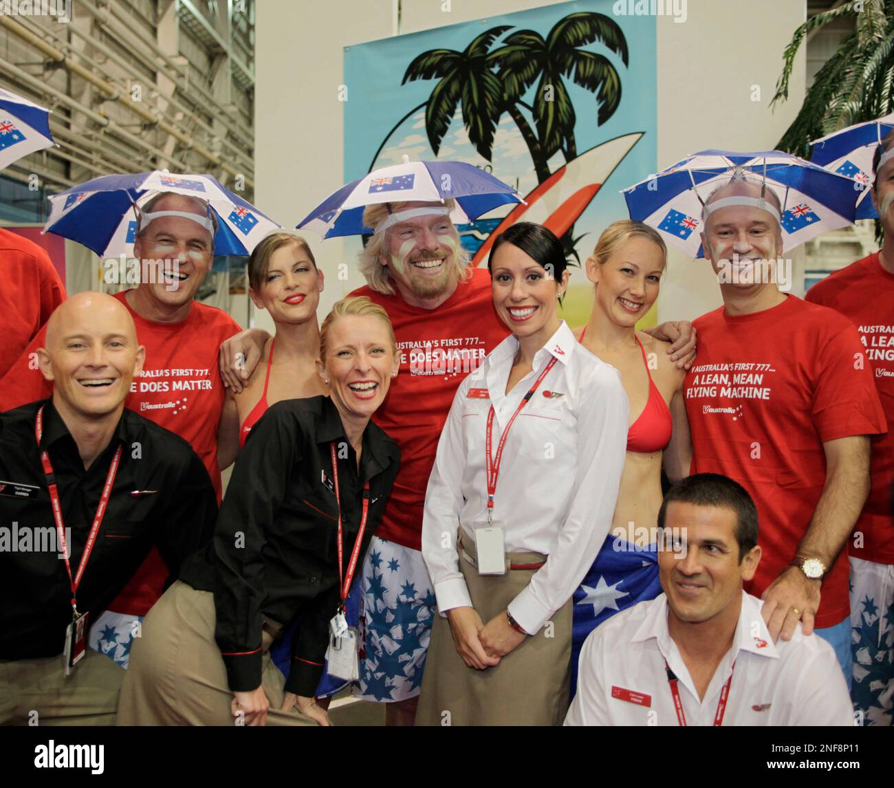Sir Richard Branson, center, chairman of Virgin Group, poses for photos ...