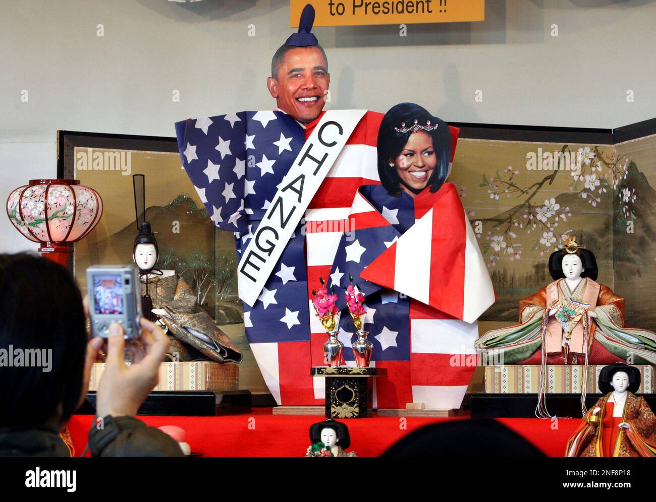 Visitors watch dolls of President Barack Obama and first lady Michelle ...