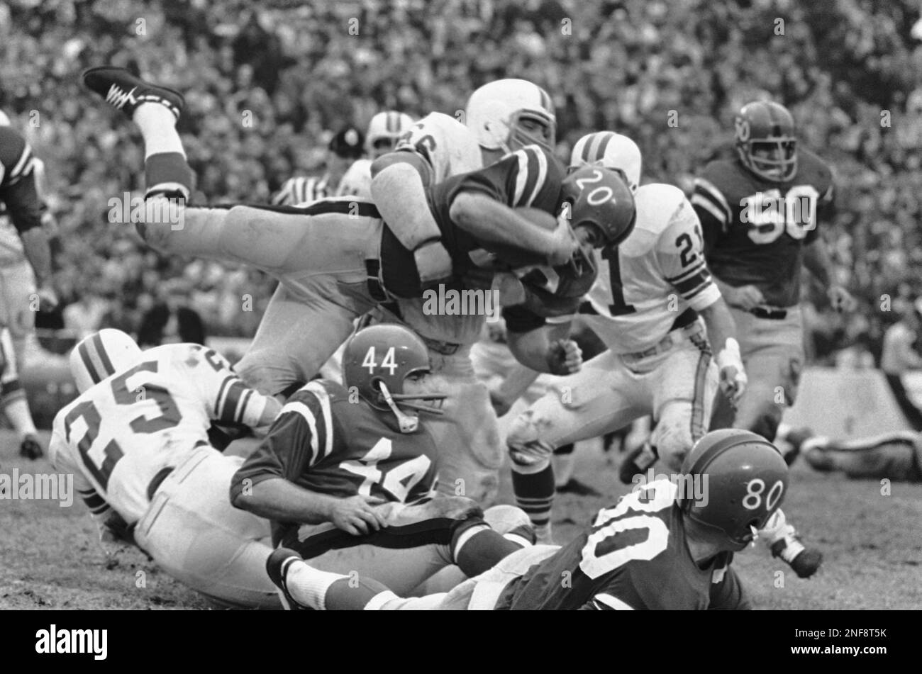 University of Mississippi tailback Mike Dennis (20) goes head first ...