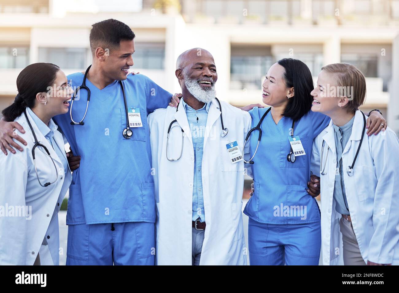 Doctor, hug and smile for healthcare collaboration, partnership, unity ...