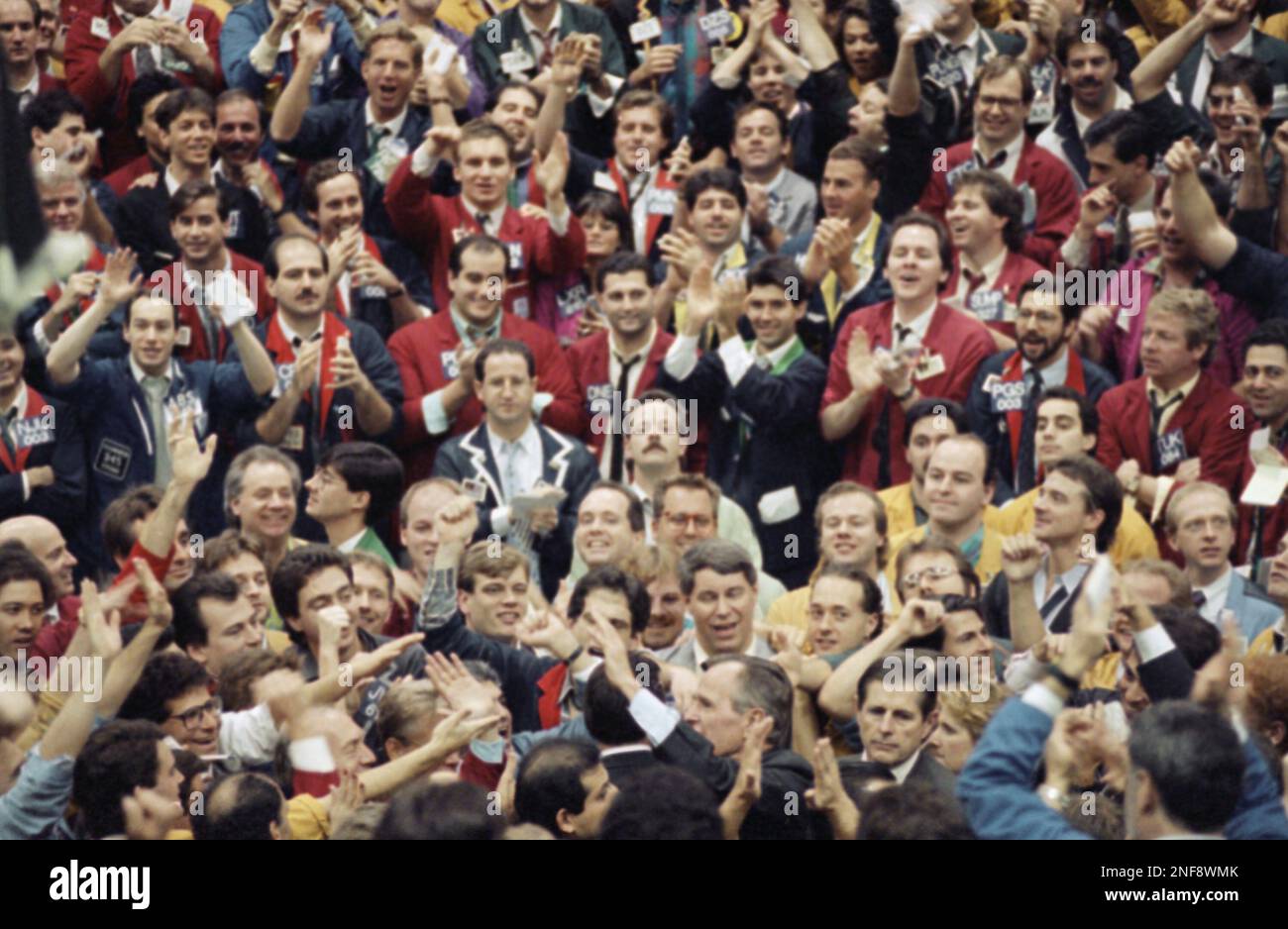 President George Bush, front center, is lost in the crowd at the ...
