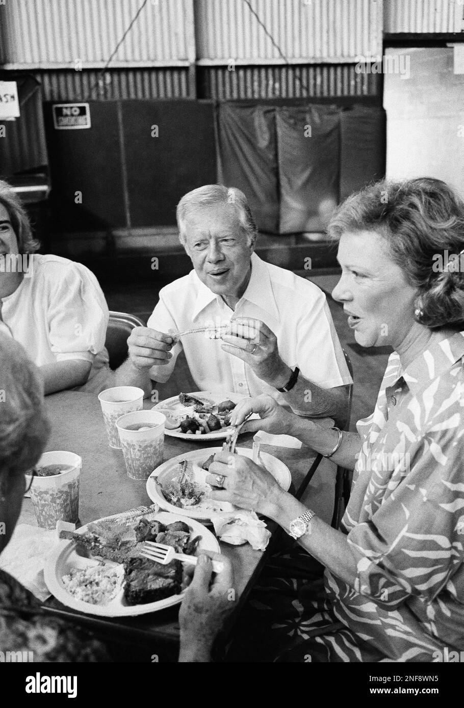 Former President Jimmy Carter and his wife Rosalynn enjoy a catfish ...