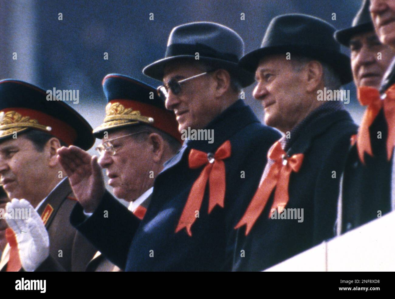 Top Soviet dignitaries wave from the Lenin Mausoleum, from left to ...