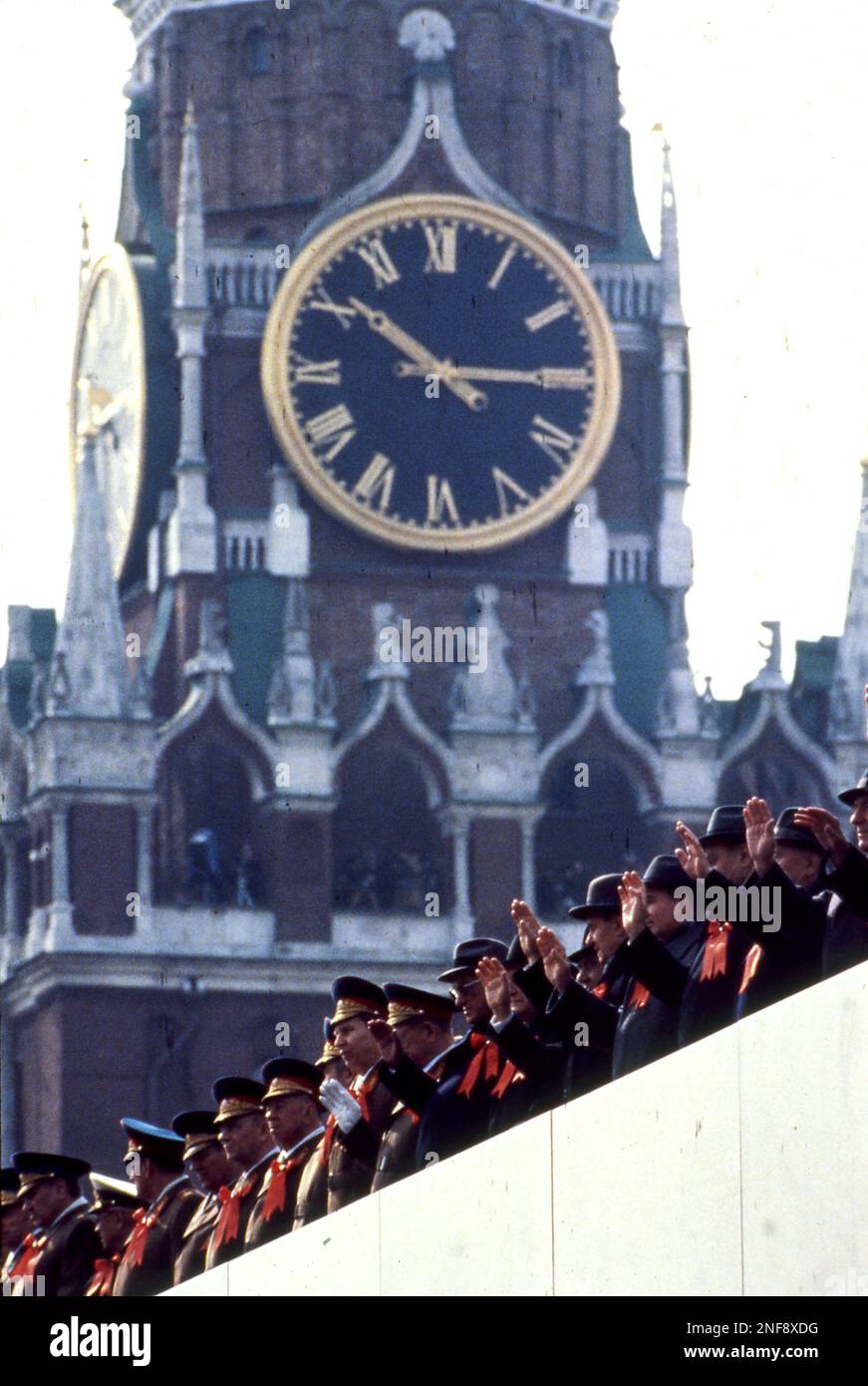Top Soviet dignitaries wave from the Lenin Mausoleum, greeting the ...