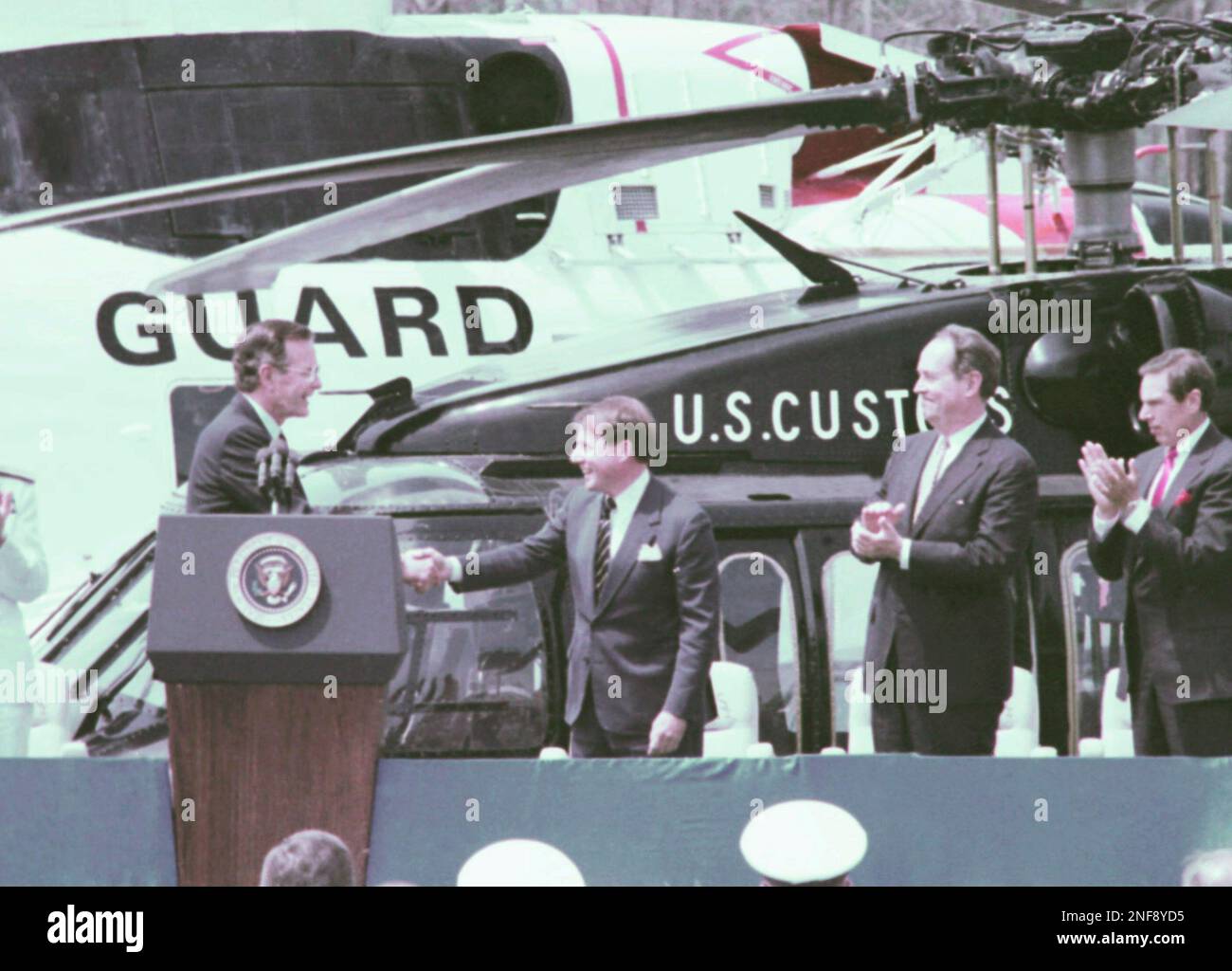 President George Bush is greeted by U.S. Customs Commissioner William ...