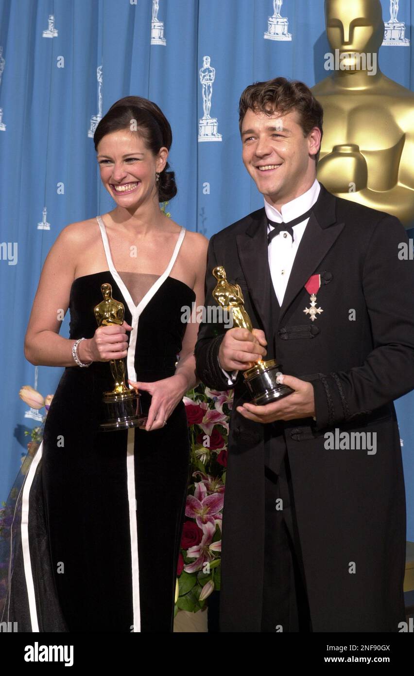 Best actress Julia Roberts and best actor Russell Crowe pose with their ...