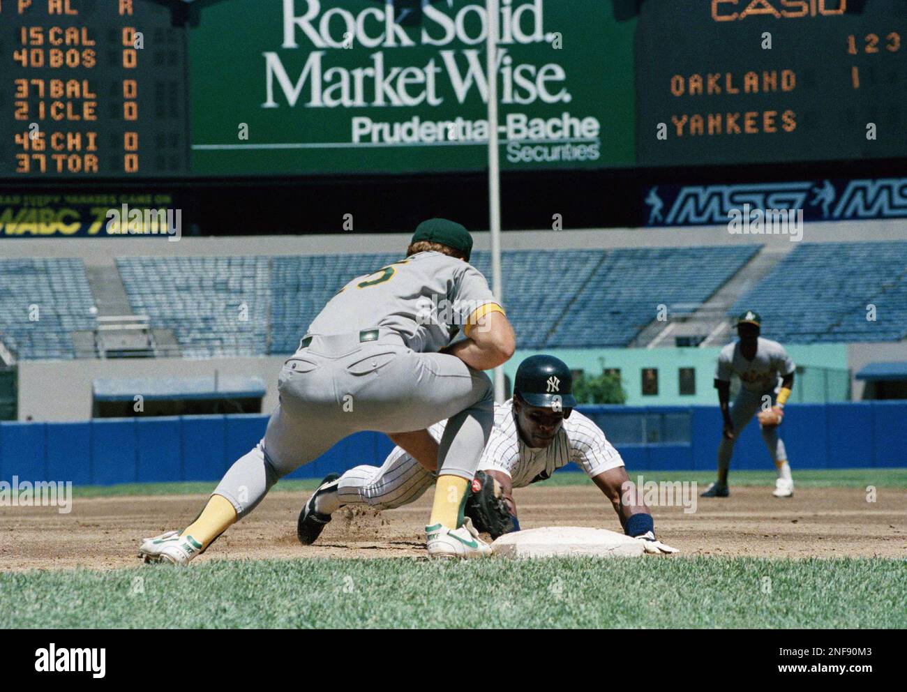 New York Yankees Rickey Henderson, right, is picked off at first base ...