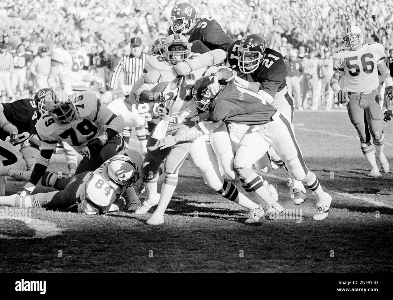 Virginia Tech defenders Rick Miley (11) Mike Scharnus (21) and Mike ...