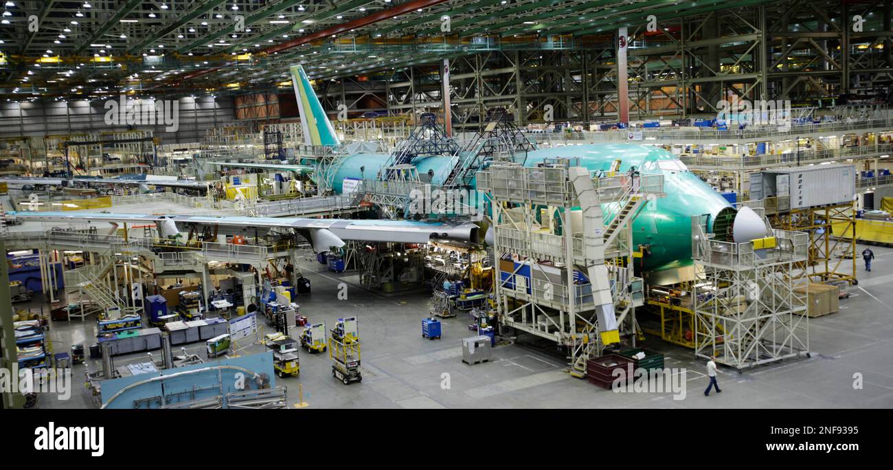 Workers assemble a Boeing 747 airplane at Boeing Co.'s airplane ...