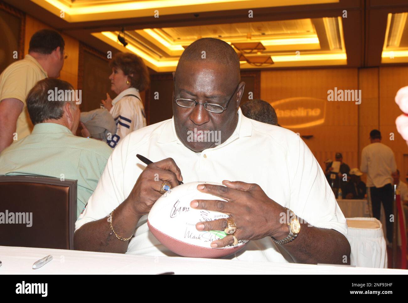 Athlete Larry Little attends Mike Ditka's Gridiron Greats Autograph ...
