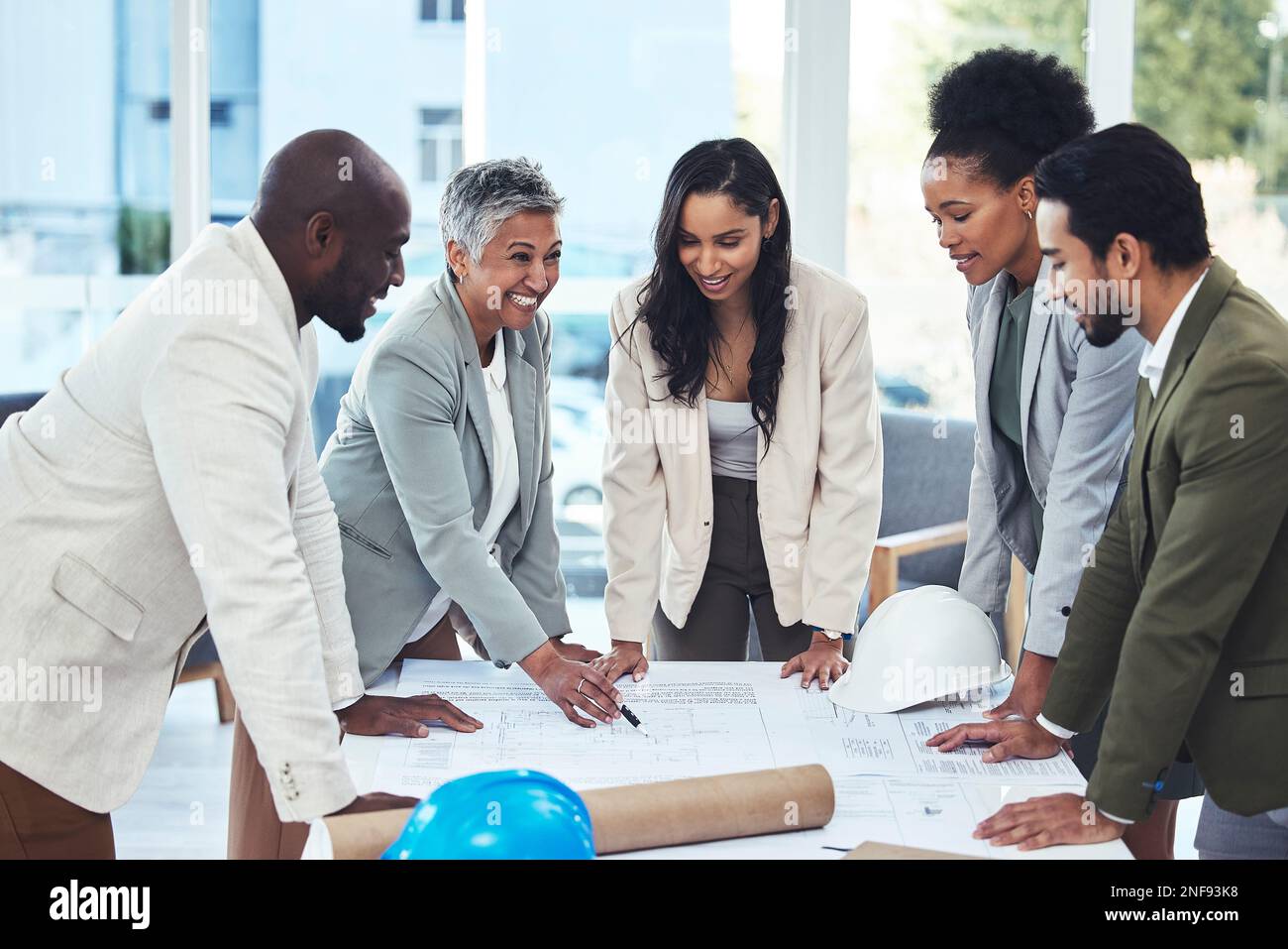 Architecture, construction and business people with blueprint for ...