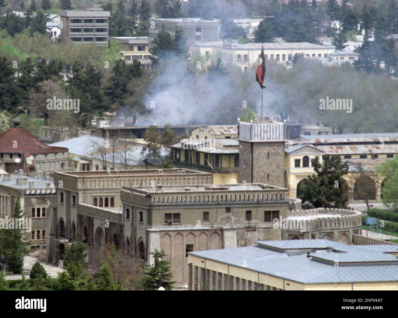 The presidential palace in Kabul, on April 26, 1992 is smoking from ...