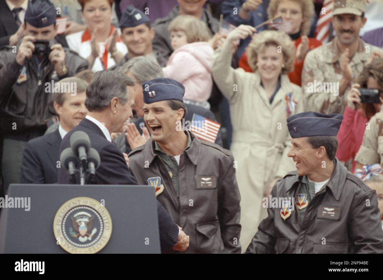 U.S. President George H. Bush greets Air Force Capt. Spike Thomas ...