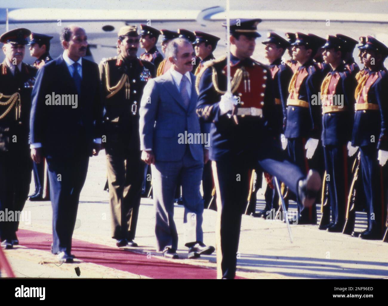 King Hussein of Jordan, on a visit to Cairo, Egypt, walks past the ...