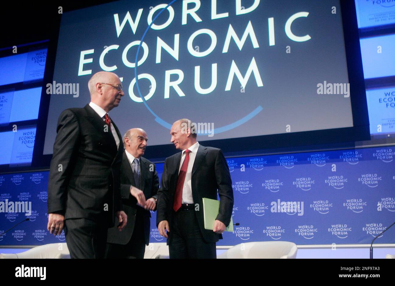 World Economic Forum founder Klaus Schwab, left, Swiss Federal ...