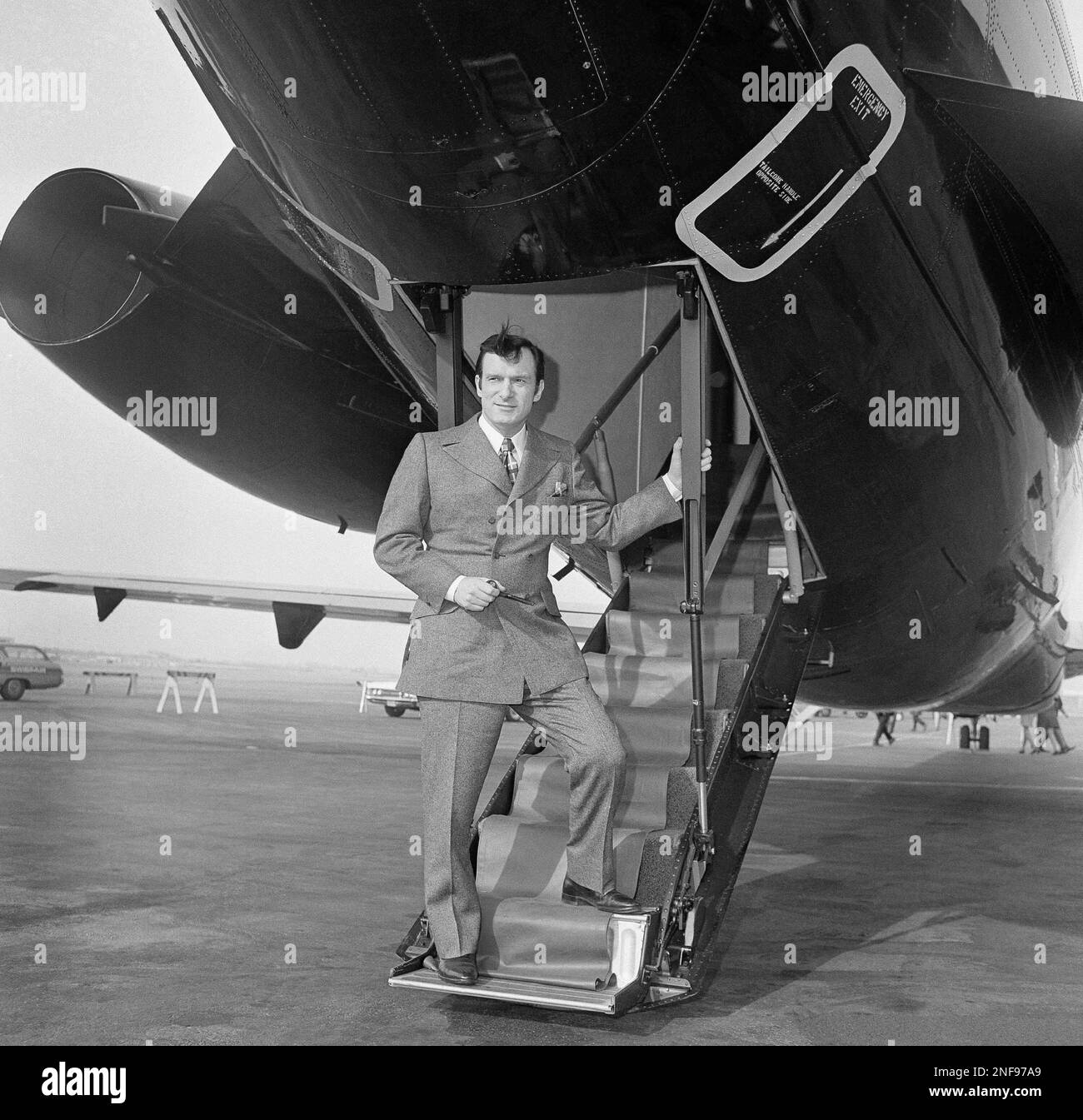 Hugh Hefner poses with his $5.5 million custom jet in Chicago, Feb. 17 ...