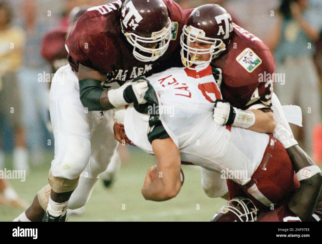 Texas A&M players Eric England, left, and Jason Atkinson work over ...