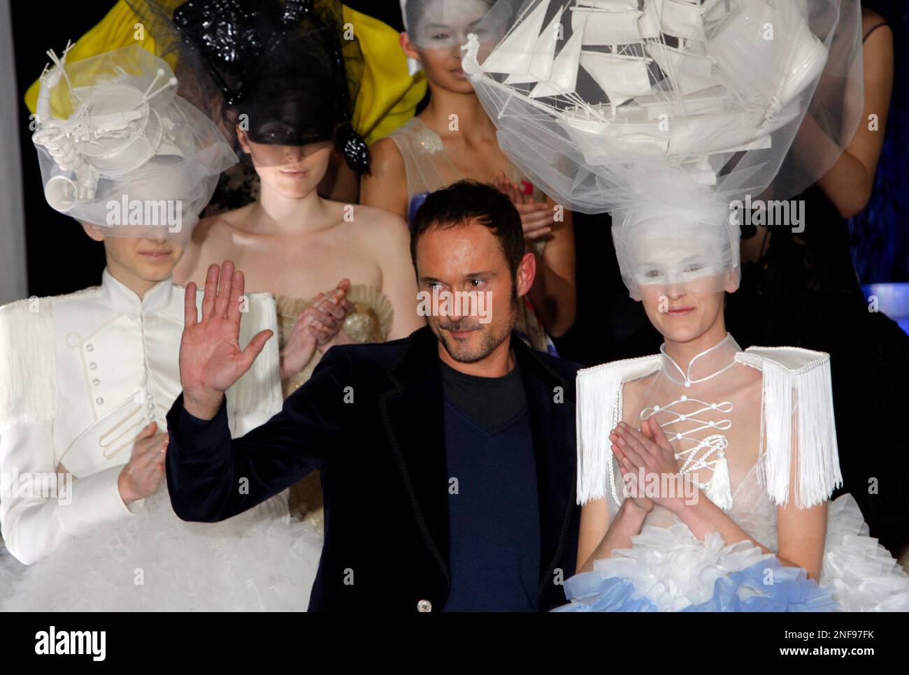 Spanish fashion designer Josep Font acknowledges applause at the end of ...
