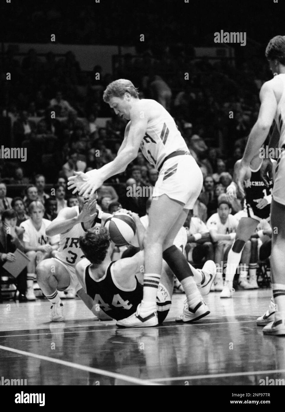 University of Michigan's Tim McCormick, center, hits the court as Notre ...