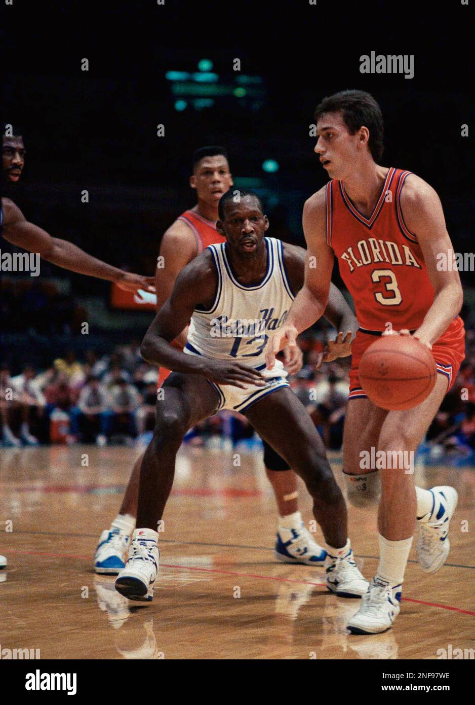 Florida's Pat Lawrence (3) makes his way past Seton Hall Salle (13) during the 1987 Big Apple ...