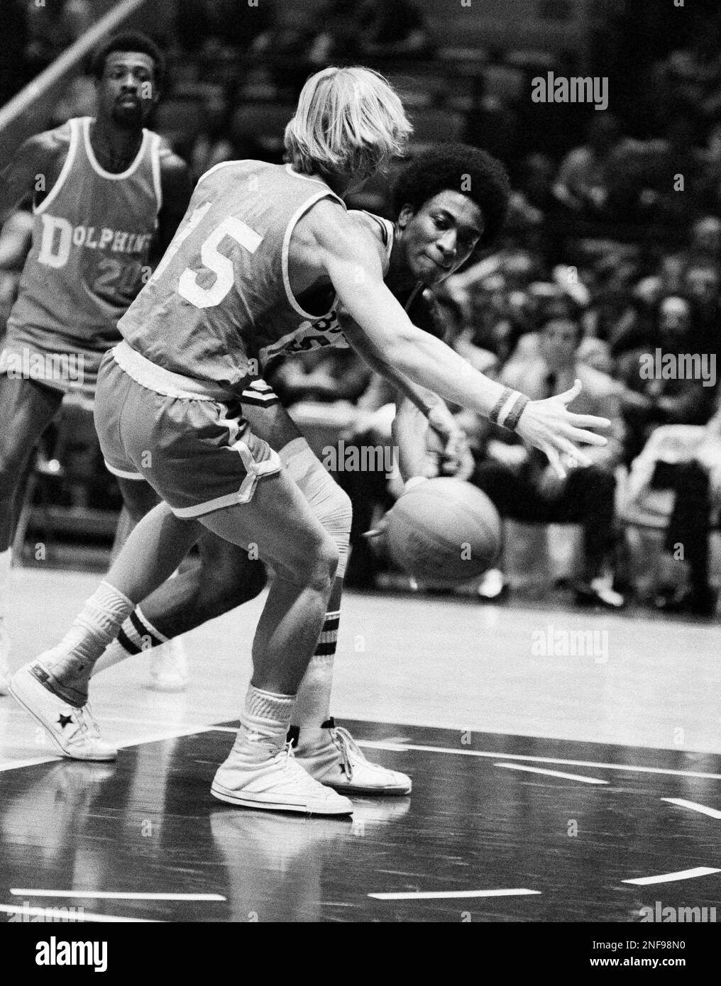Boston College's Will Morrison passes the ball under the arm of ...