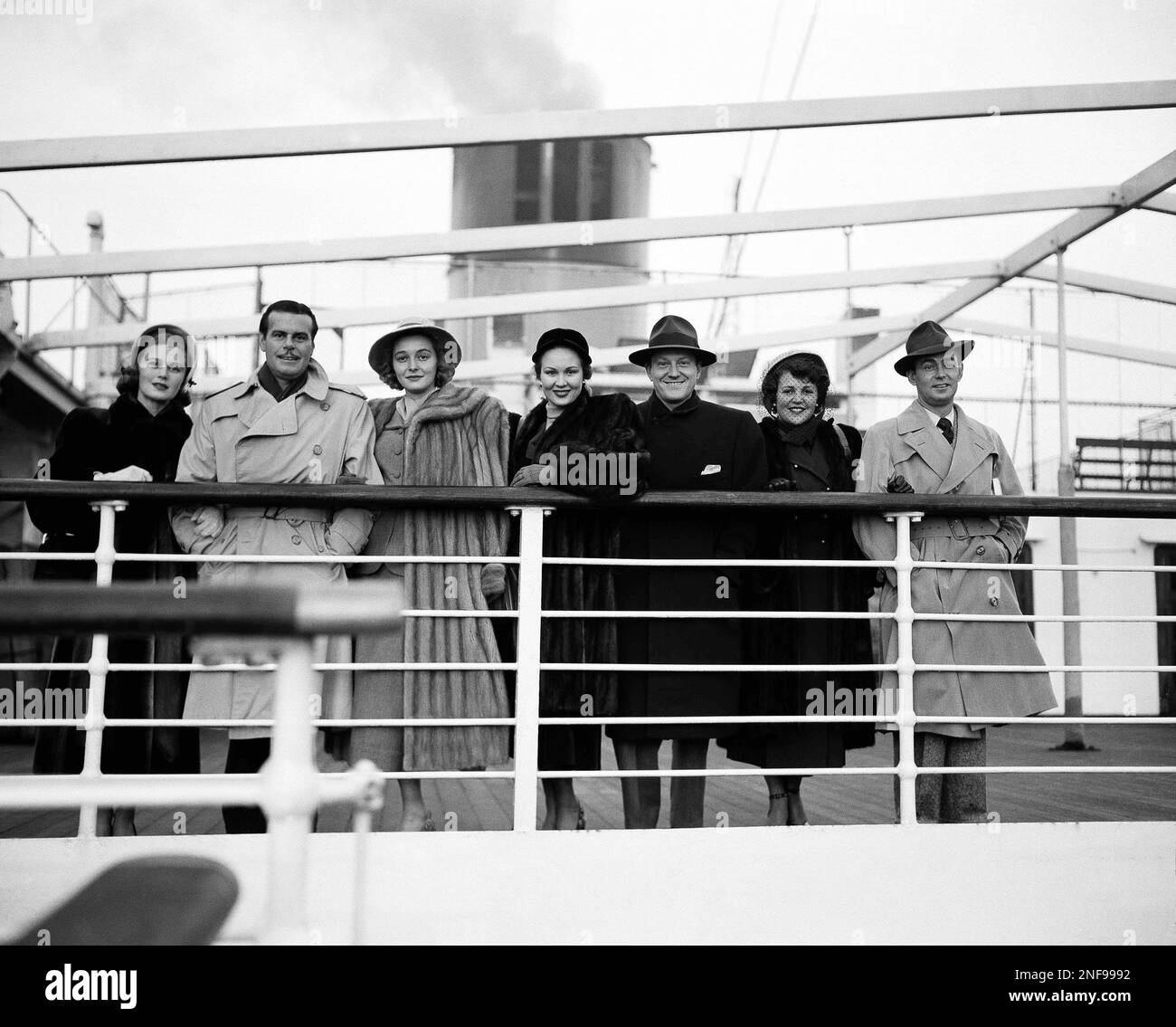 Posed along the rail of the ocean liner RMS Mauretania at Southampton ...