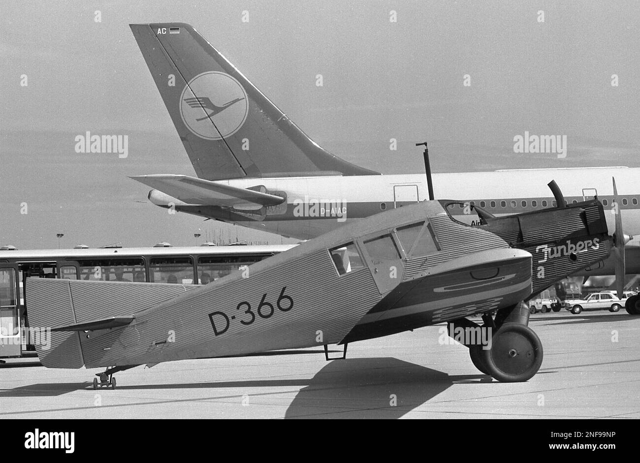A single engine Junkers F 13 plane rests on the tarmac in front of an ...