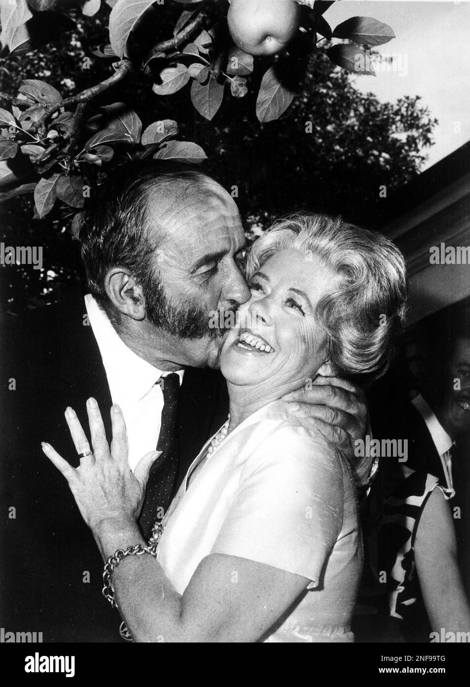 A kiss for the bride, the former Dame Zara Holt, widow of the former ...