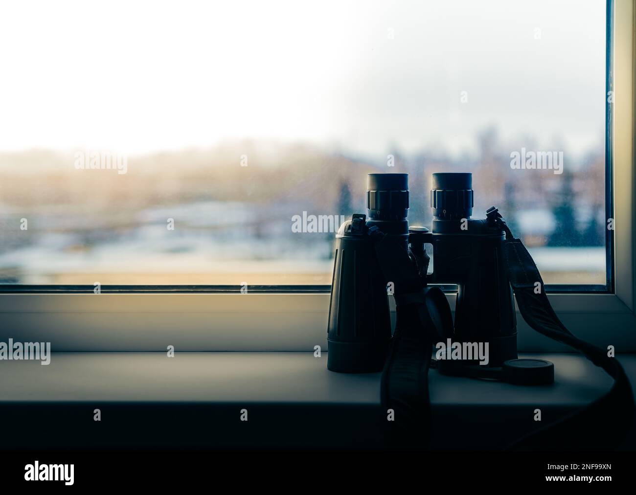 binoculars stand on the window ledge street view Stock Photo - Alamy