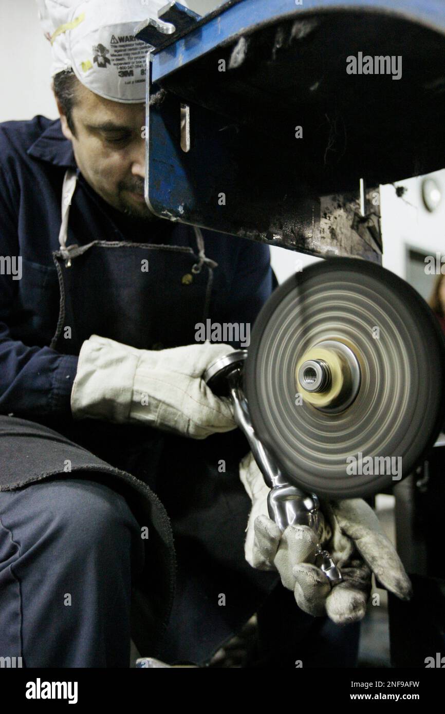 Eladio Gonzalez sands and buffs Oscar #3453 at R.S. Owens & Company ...