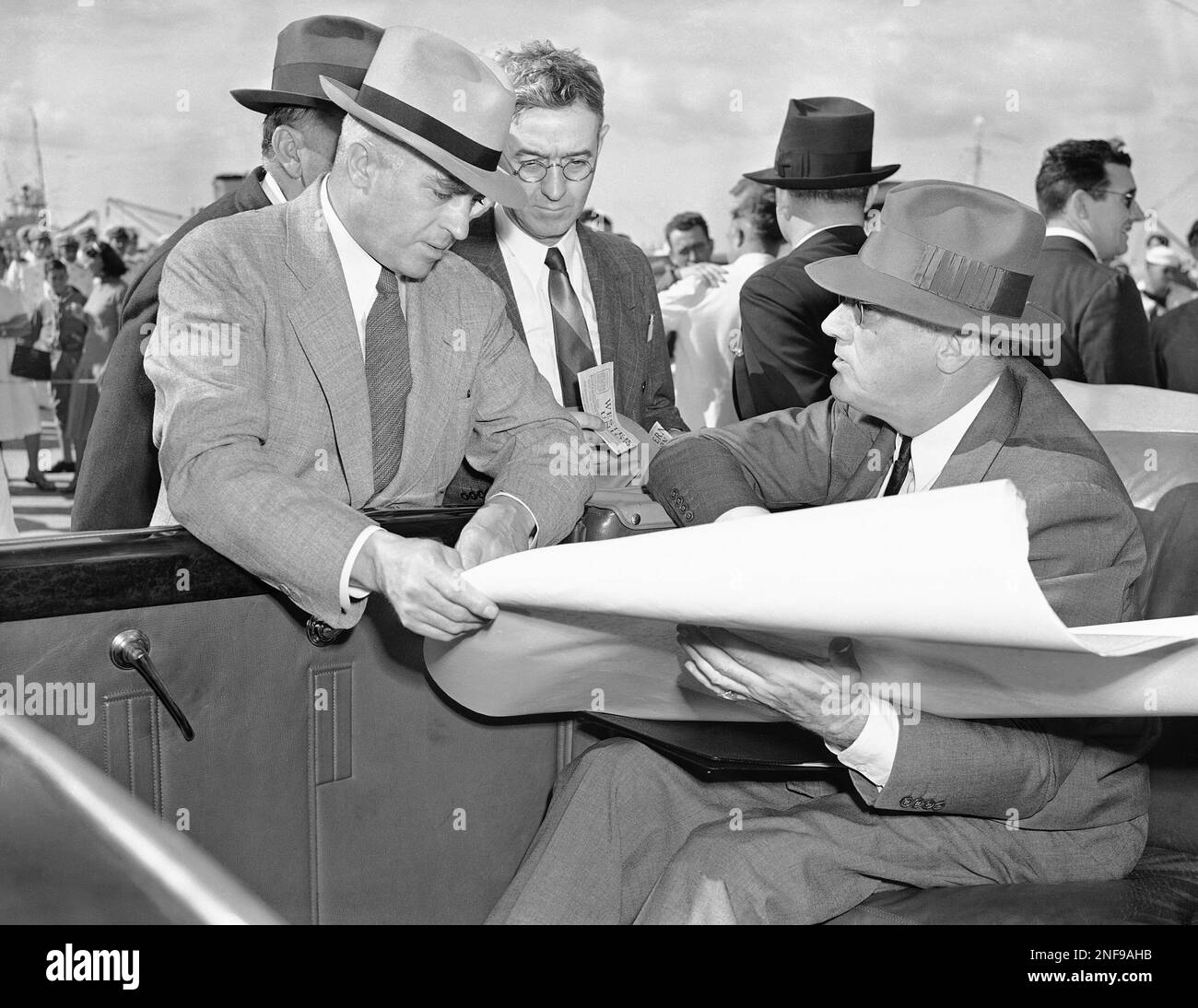 President Franklin D. Roosevelt examines a chart of south Florida ...