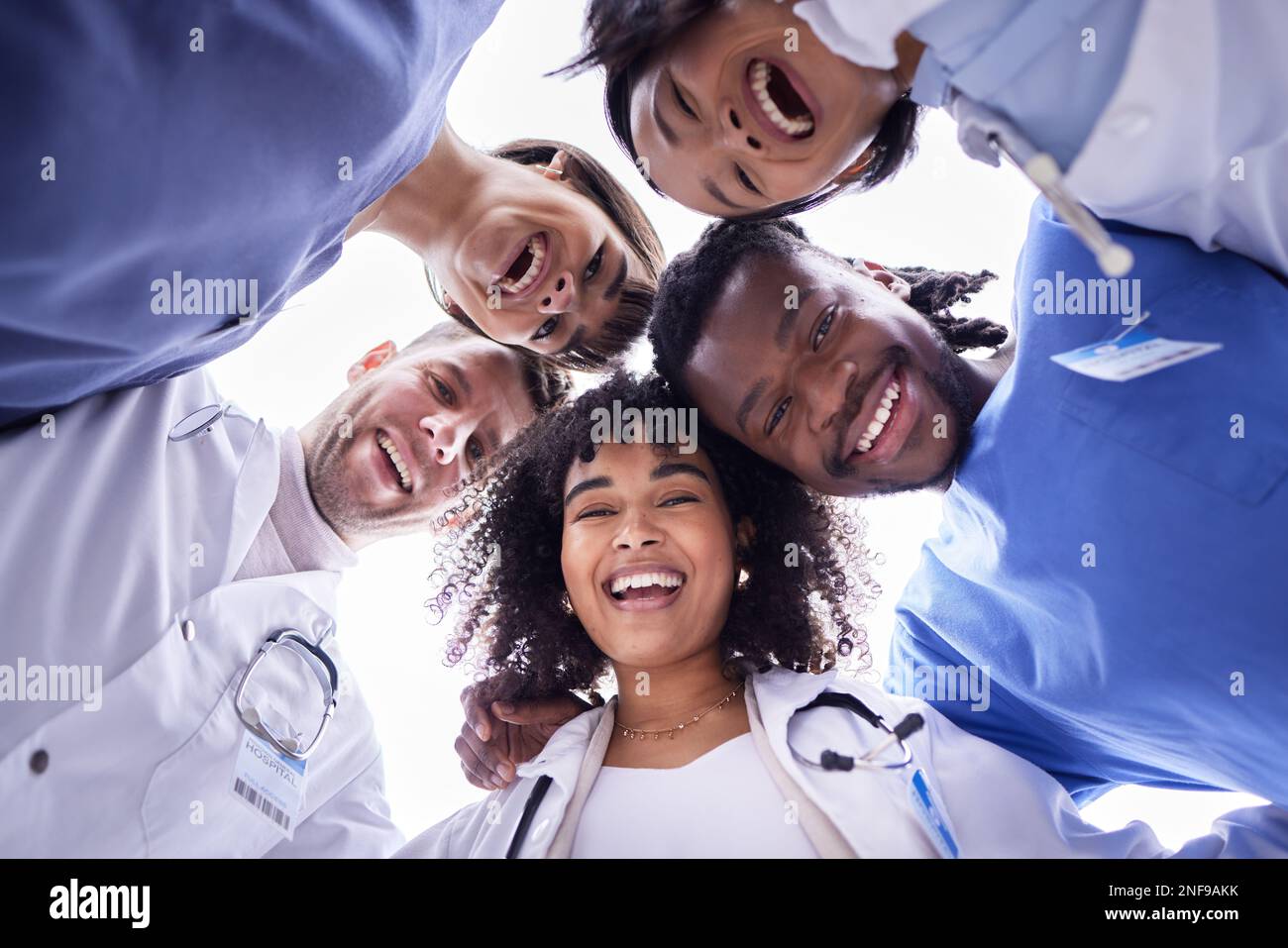 Doctor, group portrait and below circle for motivation, support and collaboration with smile ...