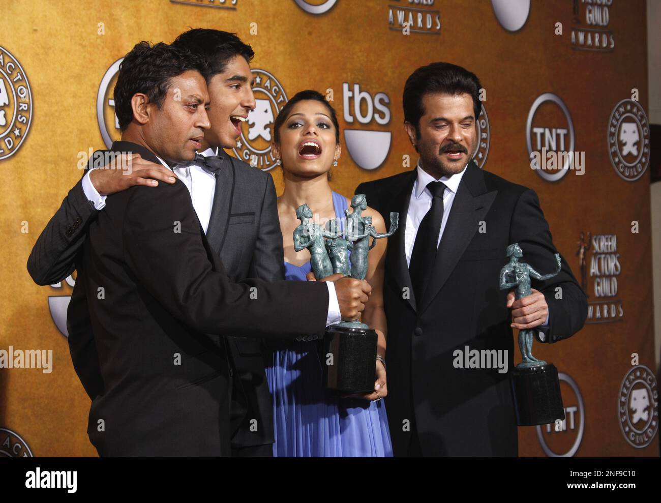 Members of the cast of "Slumdog Millionaire" pose backstage with the ...